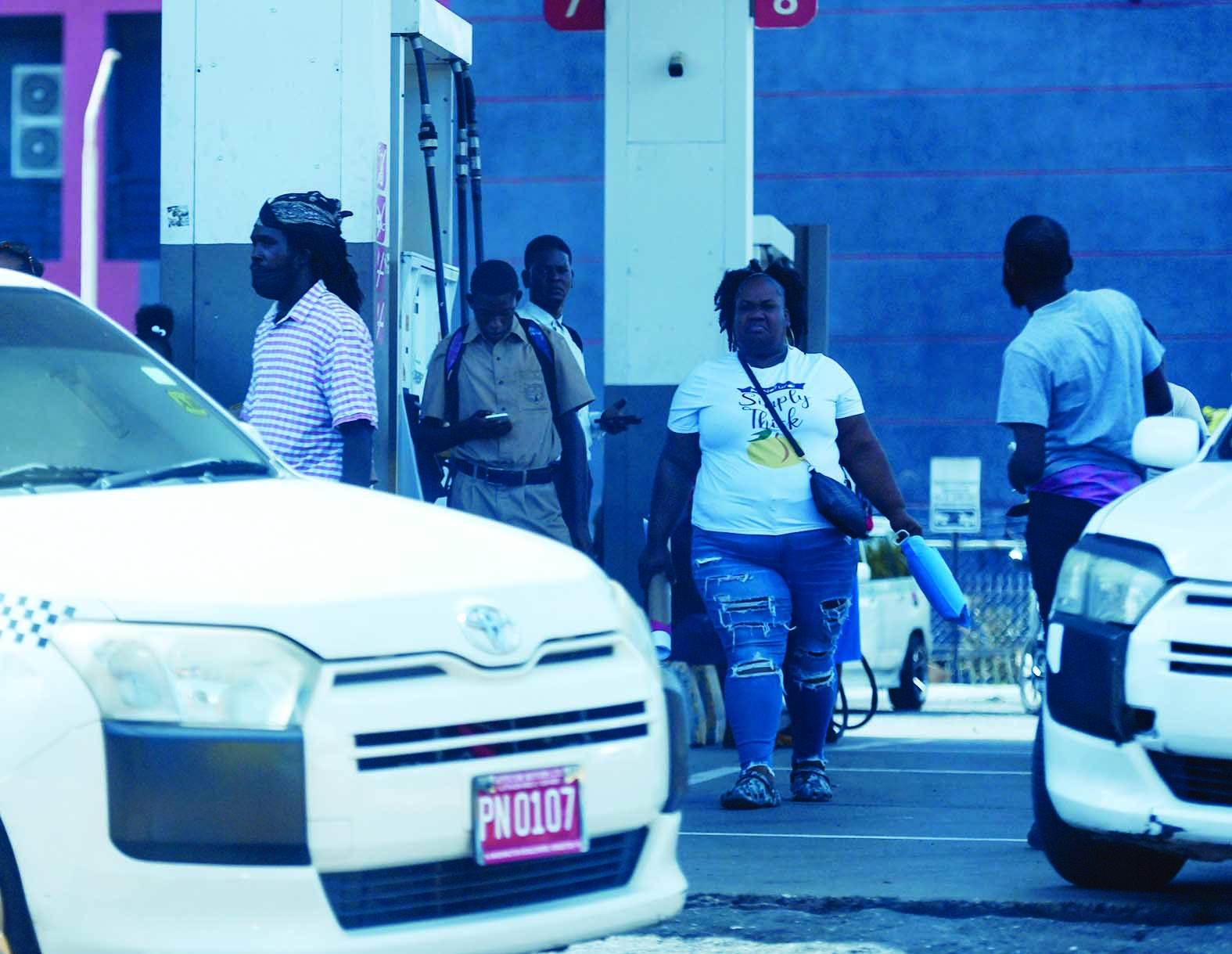 RISKING DISASTER - Students, commuters turn gas stations into gathering ...