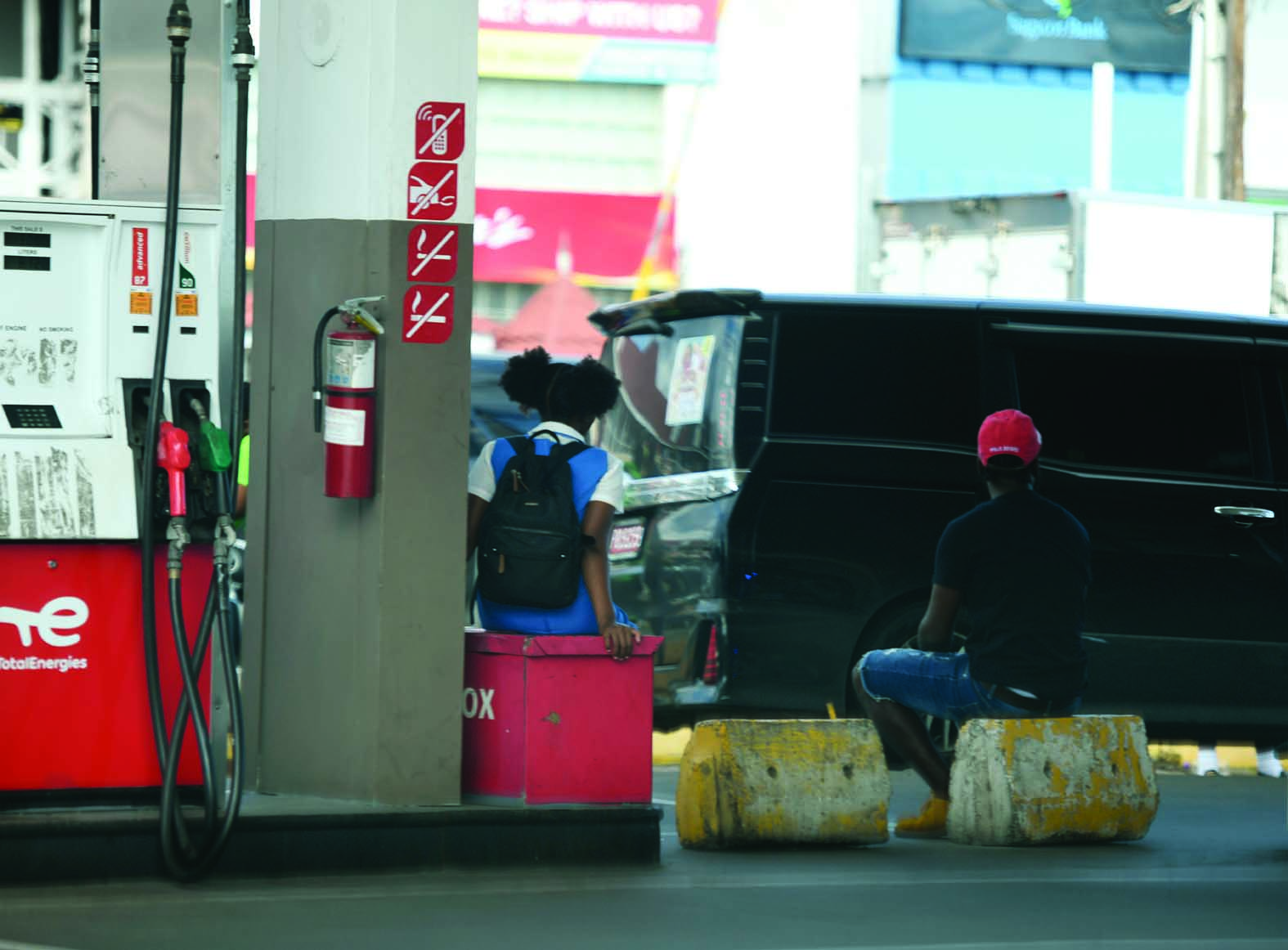 RISKING DISASTER - Students, commuters turn gas stations into gathering ...
